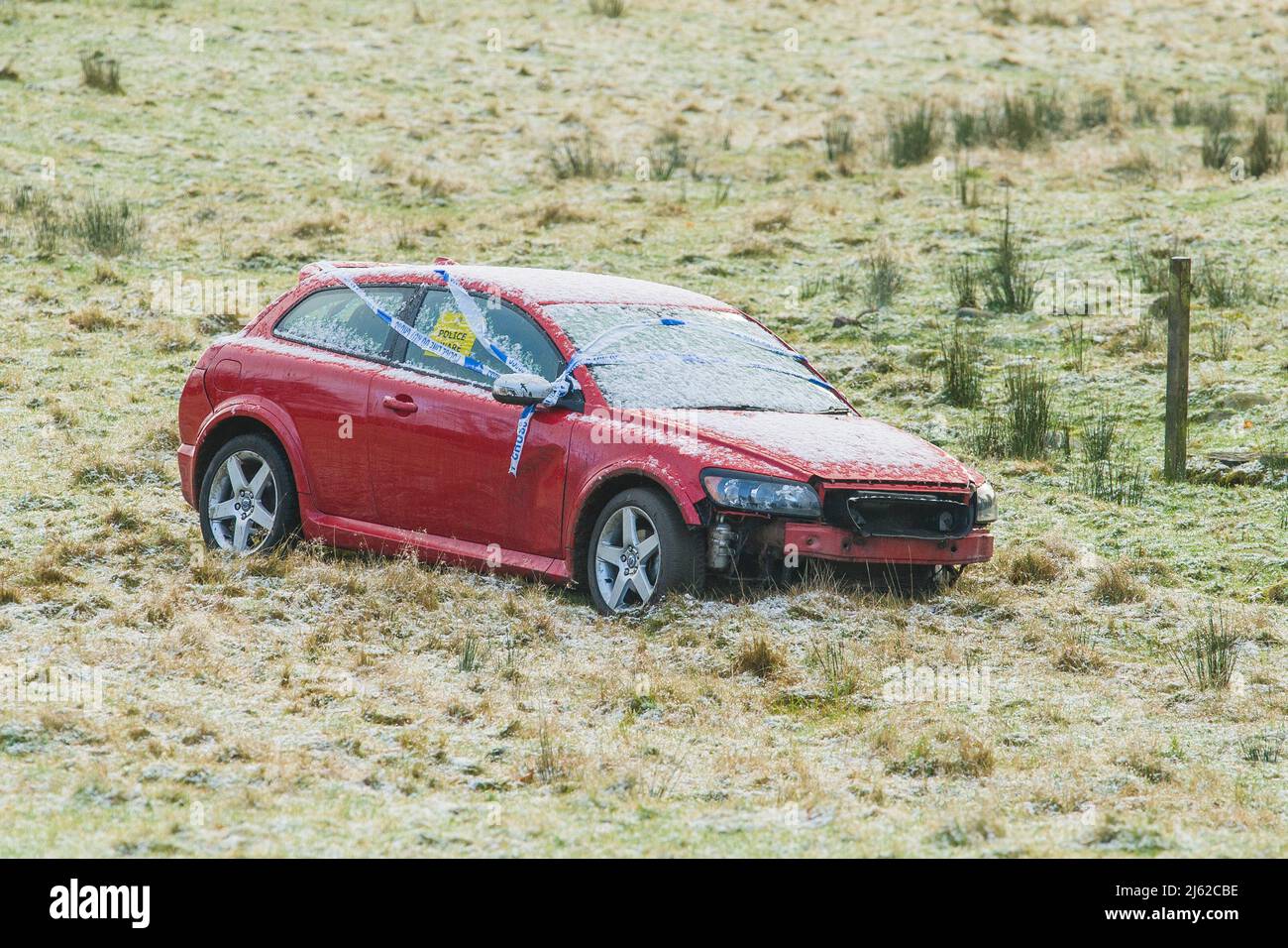 An abandoned crashed car is left in a field by Callander with a police ...