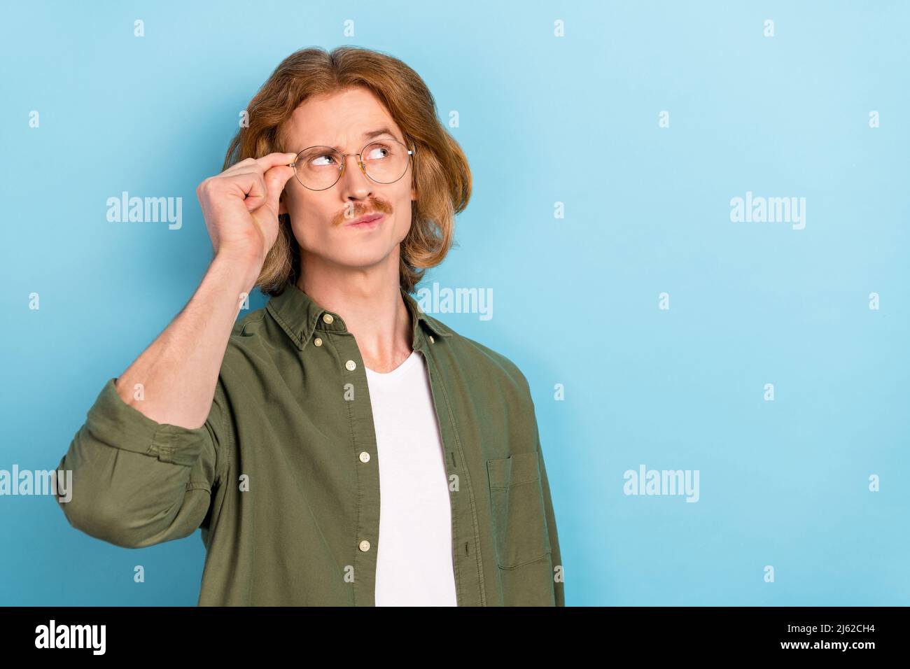 Portrait of attractive sullen skeptic funky bewildered guy touching ...