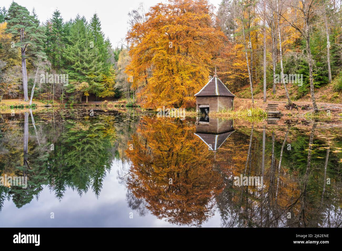 Autumn colours, Loch Dunmore boathouse in Faskally Forest near ...