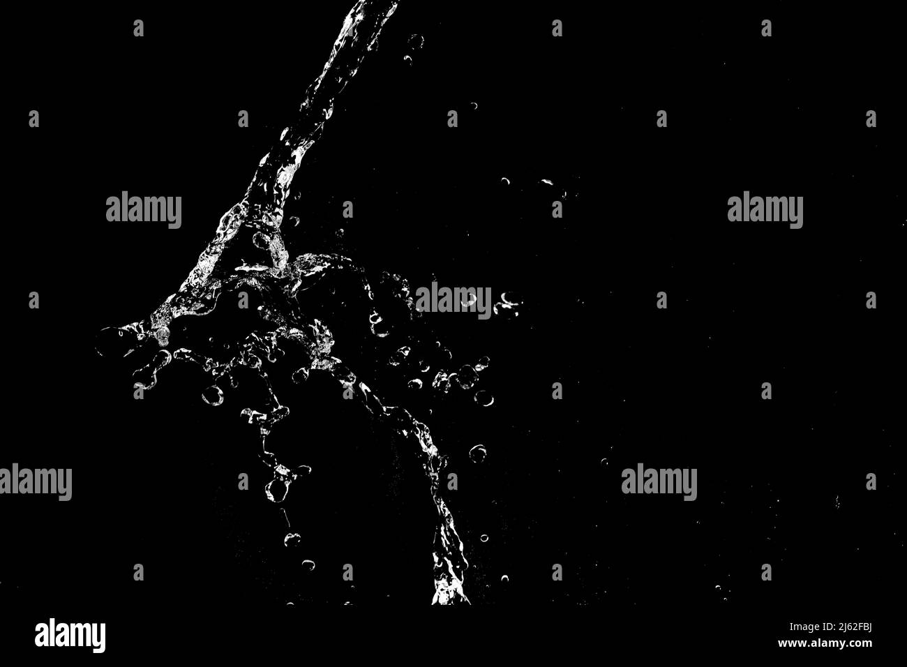 water splashes isolated on black background. white jets with drops ...