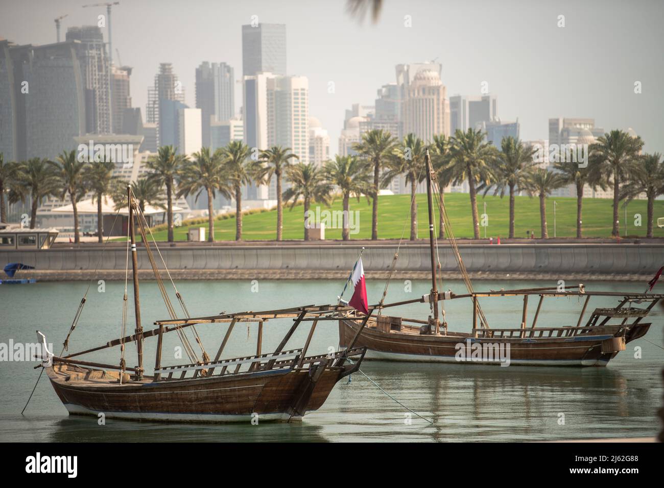 Doha,Qatar- April 24,2022 : Traditional dhow boats with the futuristic ...