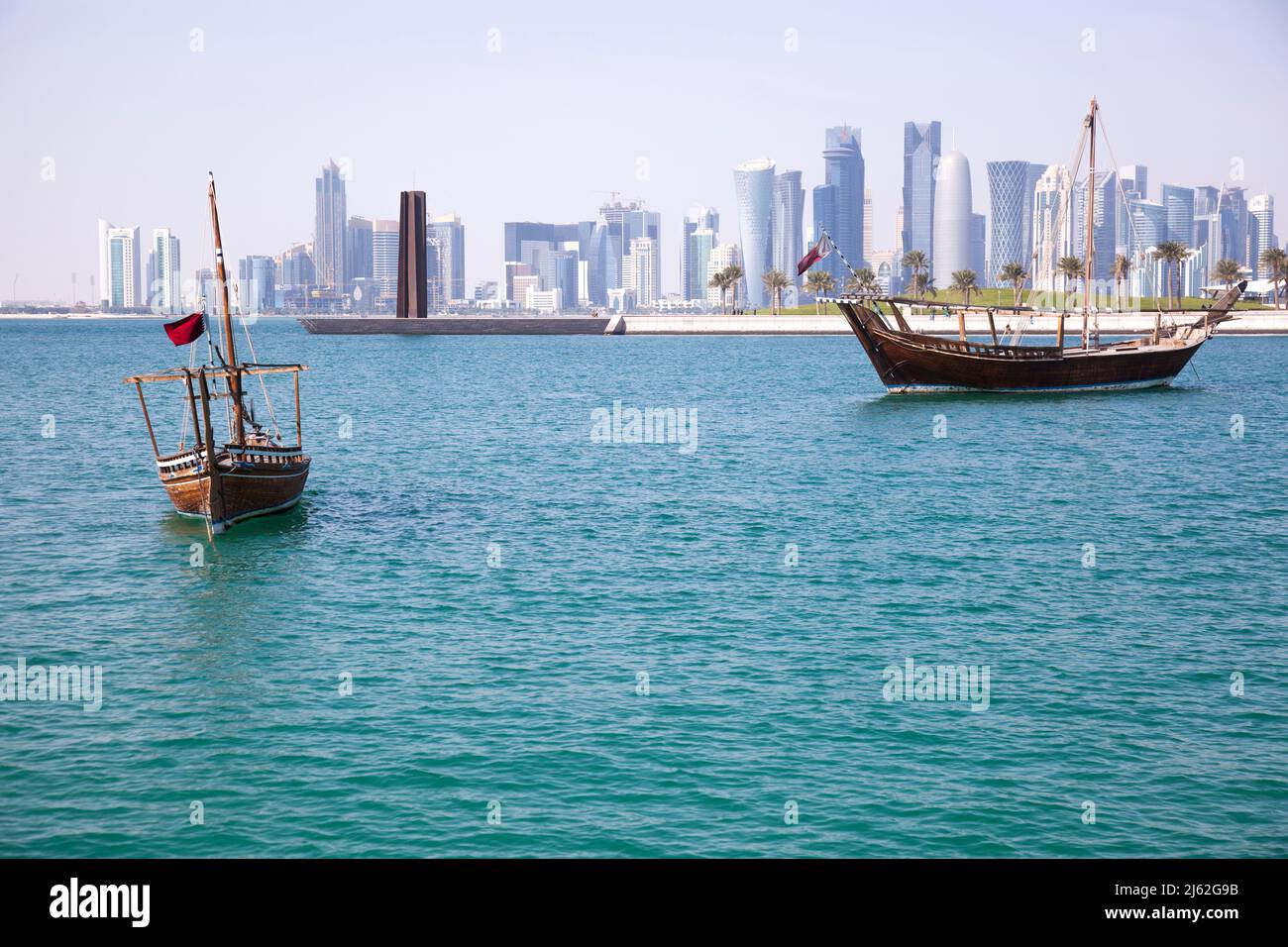Doha,Qatar- April 24,2022 : Traditional dhow boats with the futuristic ...