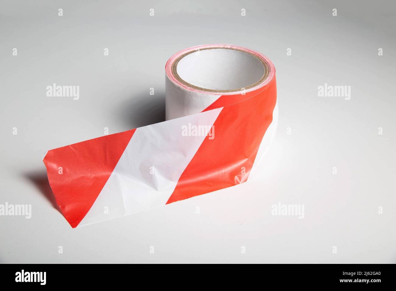 Red-white striped ribbon on a white background, isolate. Prohibition ...