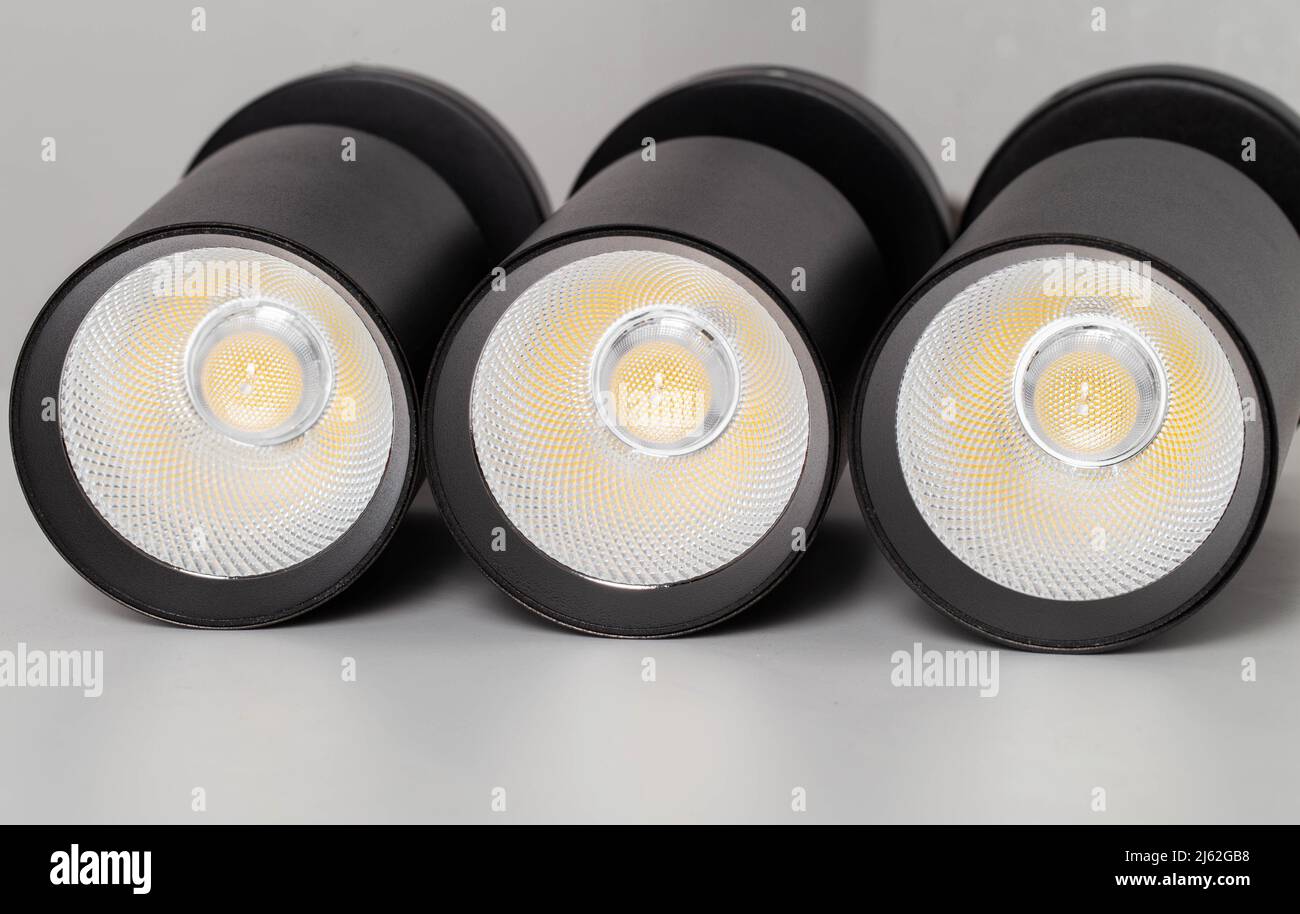 Black pendant lamps with matrix LED lighting on a white background ...