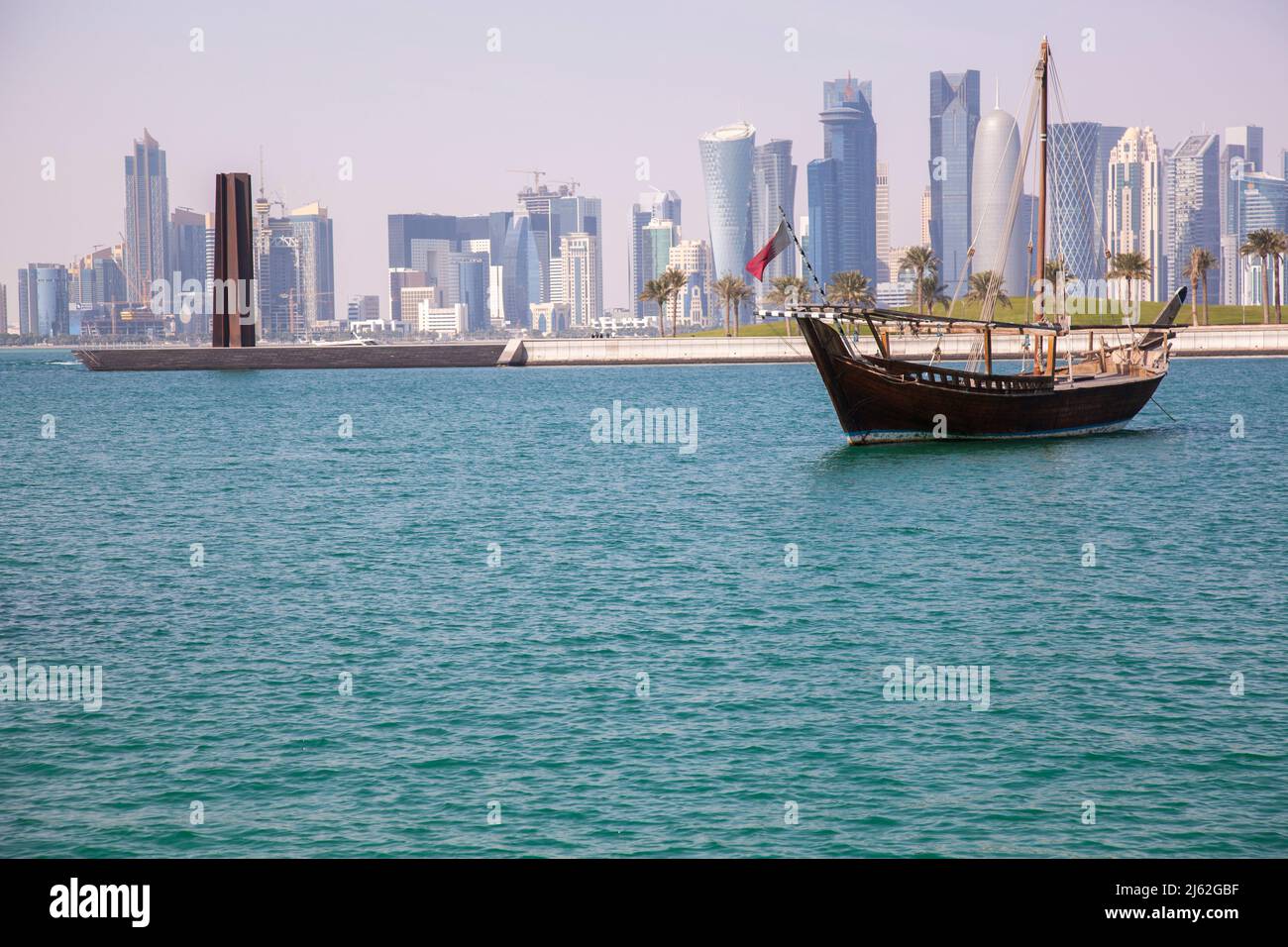 Doha,Qatar- April 24,2022 : Traditional dhow boats with the futuristic ...