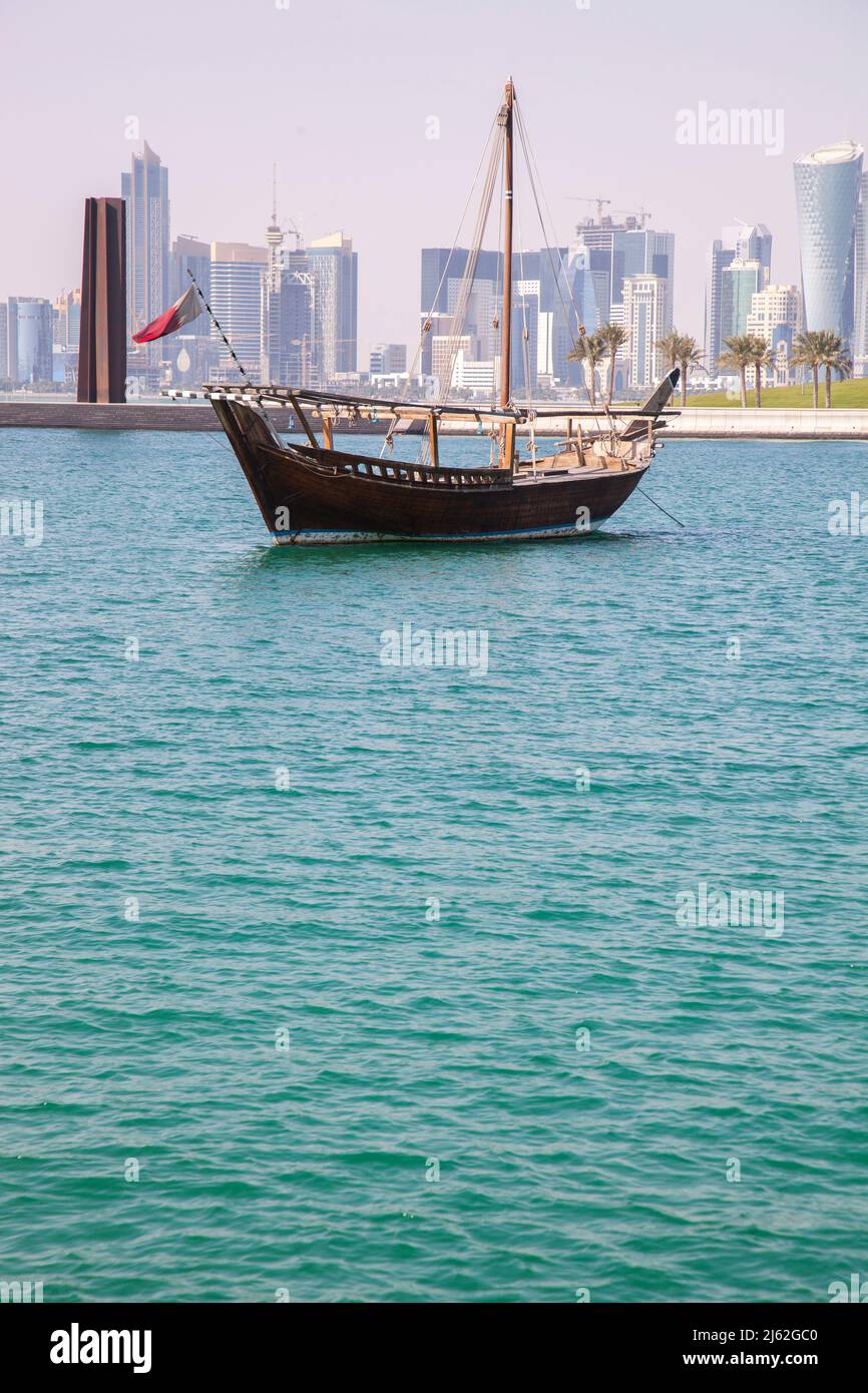 Doha,Qatar- April 24,2022 : Traditional dhow boats with the futuristic ...