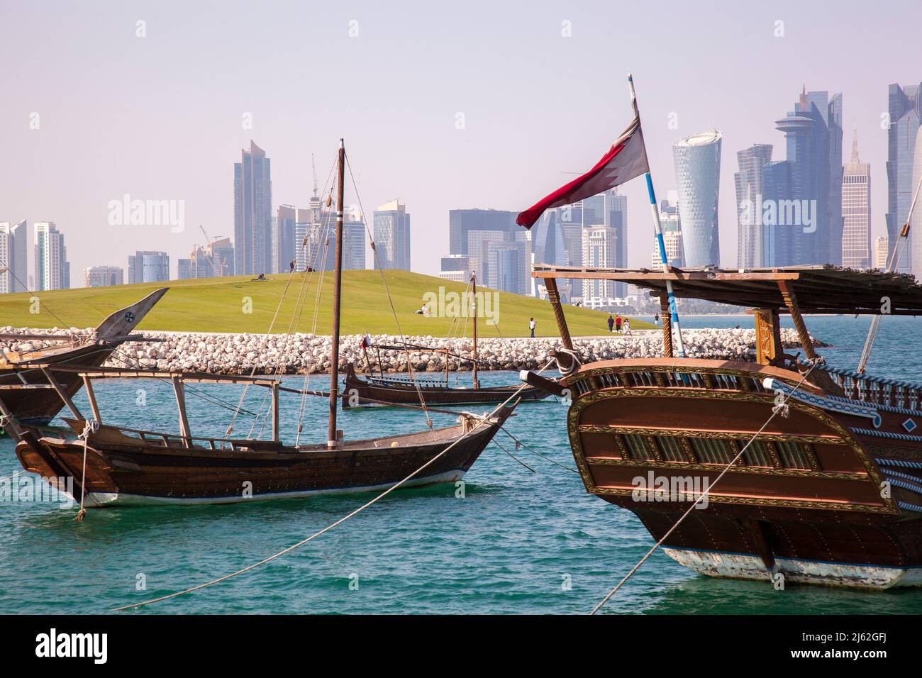 Doha,Qatar- April 24,2022 : Traditional dhow boats with the futuristic ...