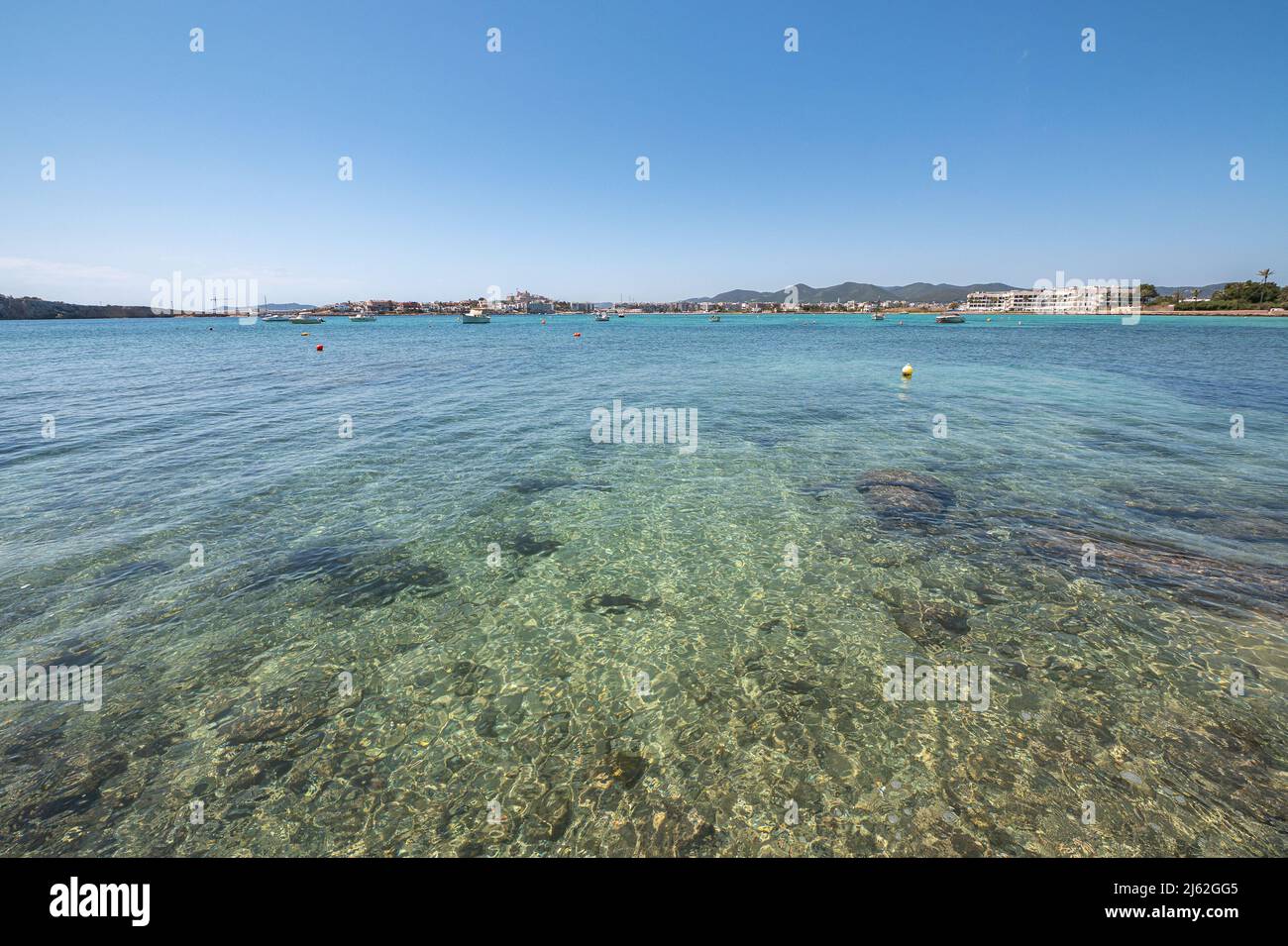 Turquoise waters of the Mediterranean in the Bay of Talamanca in Ibiza ...