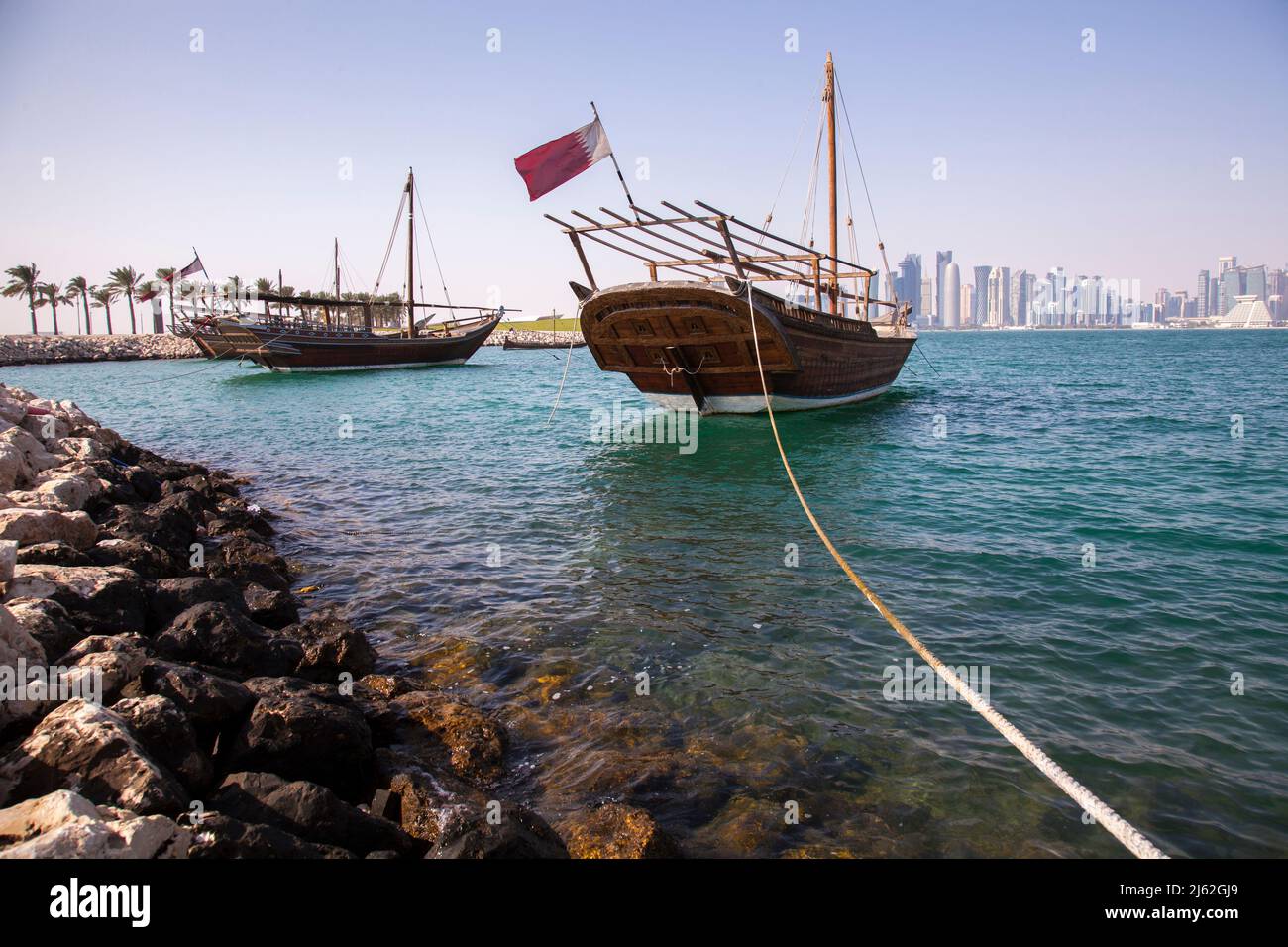 Doha,Qatar- April 24,2022 : Traditional dhow boats with the futuristic ...