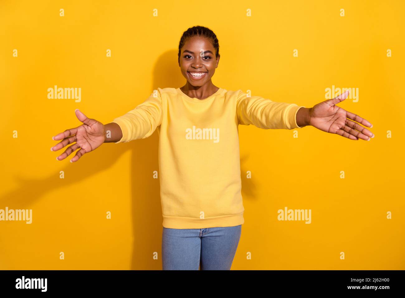 Portrait of attractive cheerful girl calling you come to me hugging ...