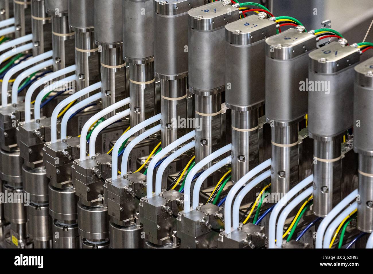 Neutraubling, Germany. 25th Apr, 2022. A close-up of a filling line in ...