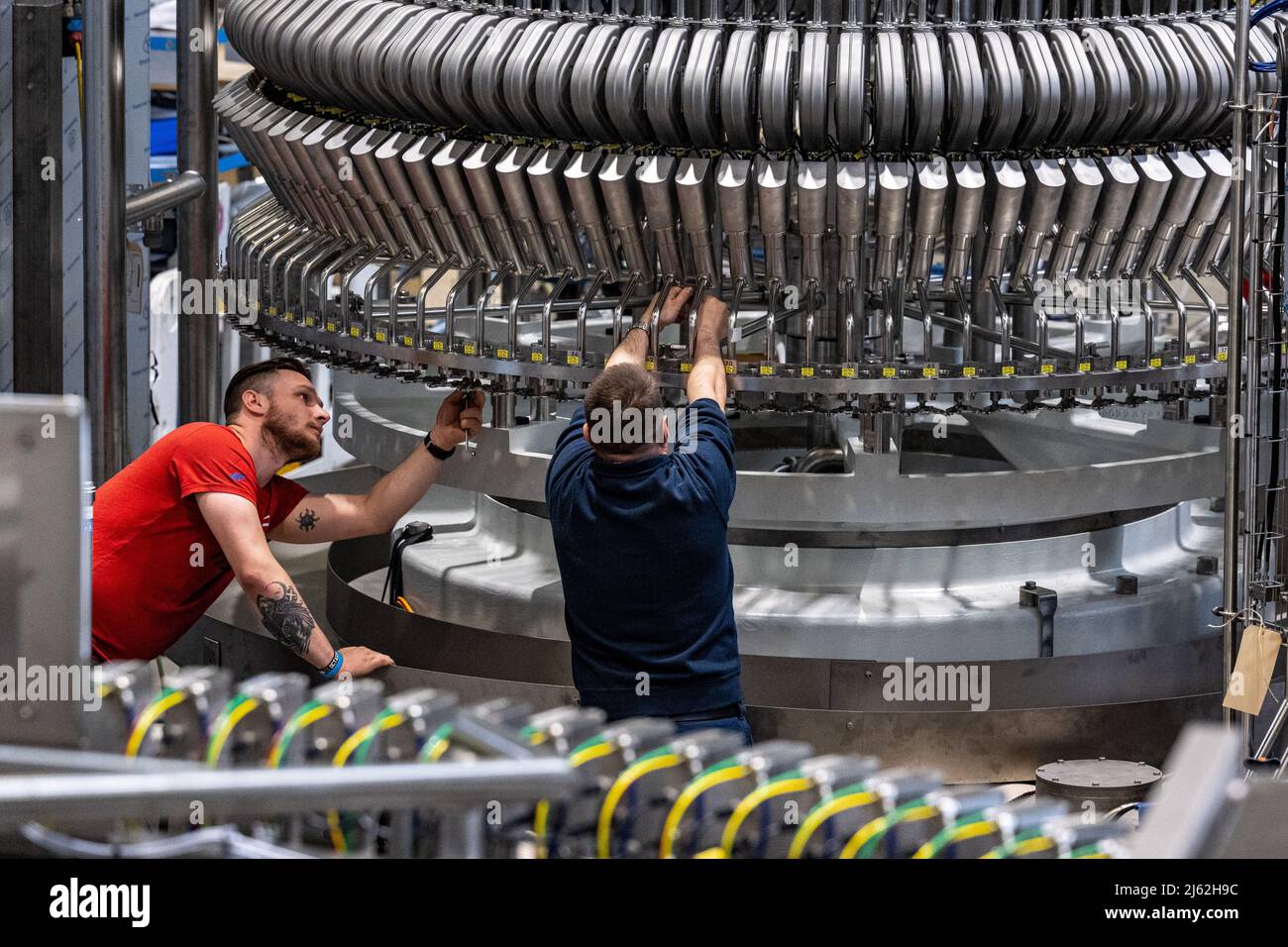 Neutraubling, Germany. 25th Apr, 2022. Krones AG employee working on a ...