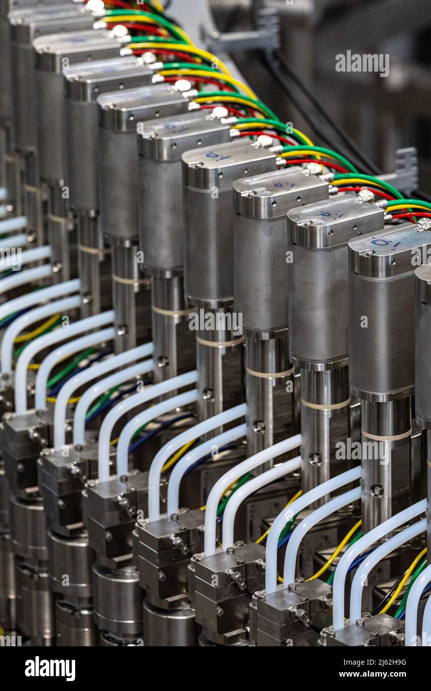 Neutraubling, Germany. 25th Apr, 2022. A close-up of a filling line in ...