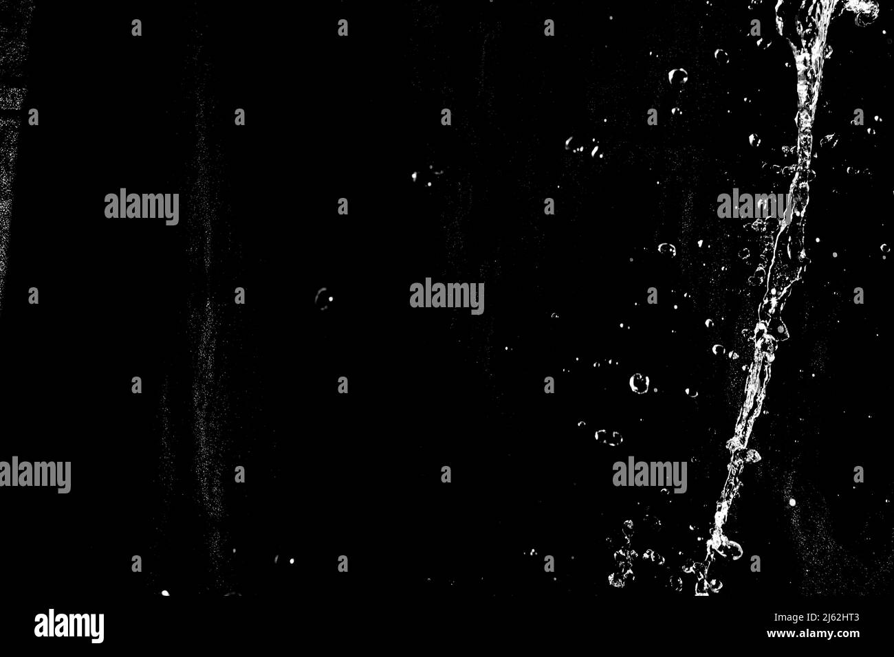 water splashes isolated on black background. white jets with drops ...
