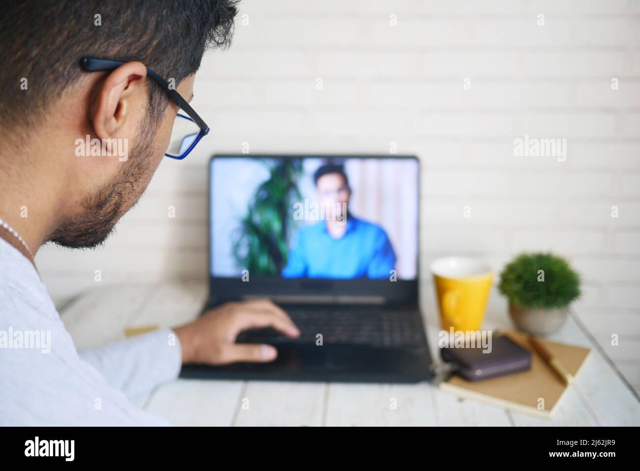 Back view of business man in video conference discussing strategy Stock ...