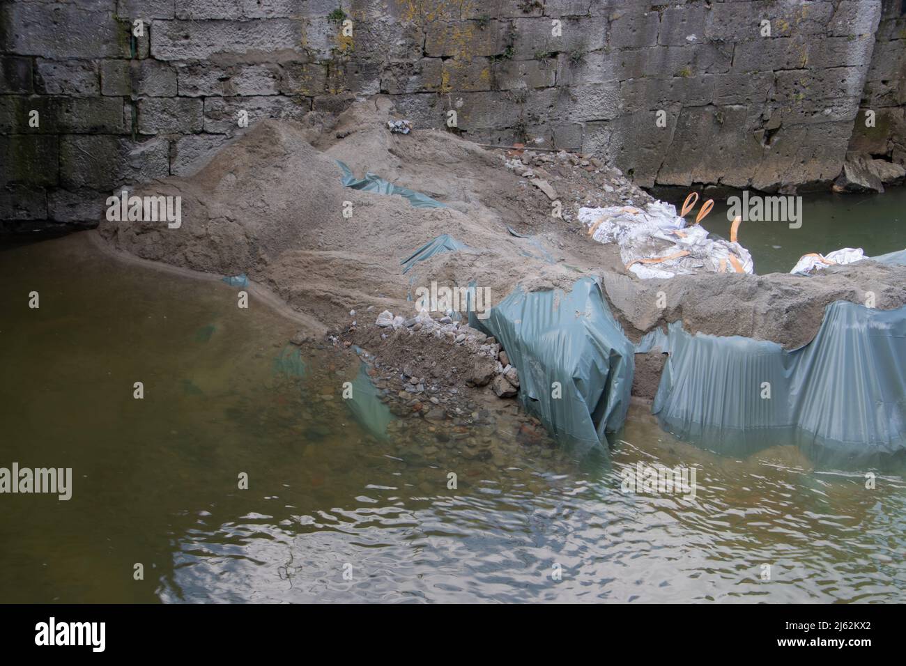 Sandbags for artificial barrier in a river protecting a construction ...