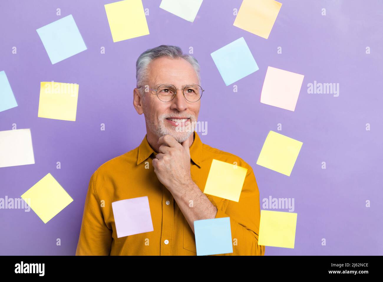 Photo of thought elder grey hairdo man look notes wear eyewear yellow ...