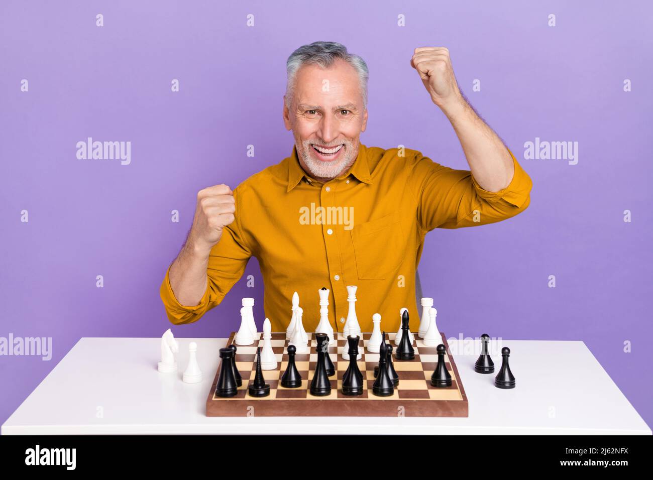 Photo of mature man fists hands celebrate victory awesome competition ...