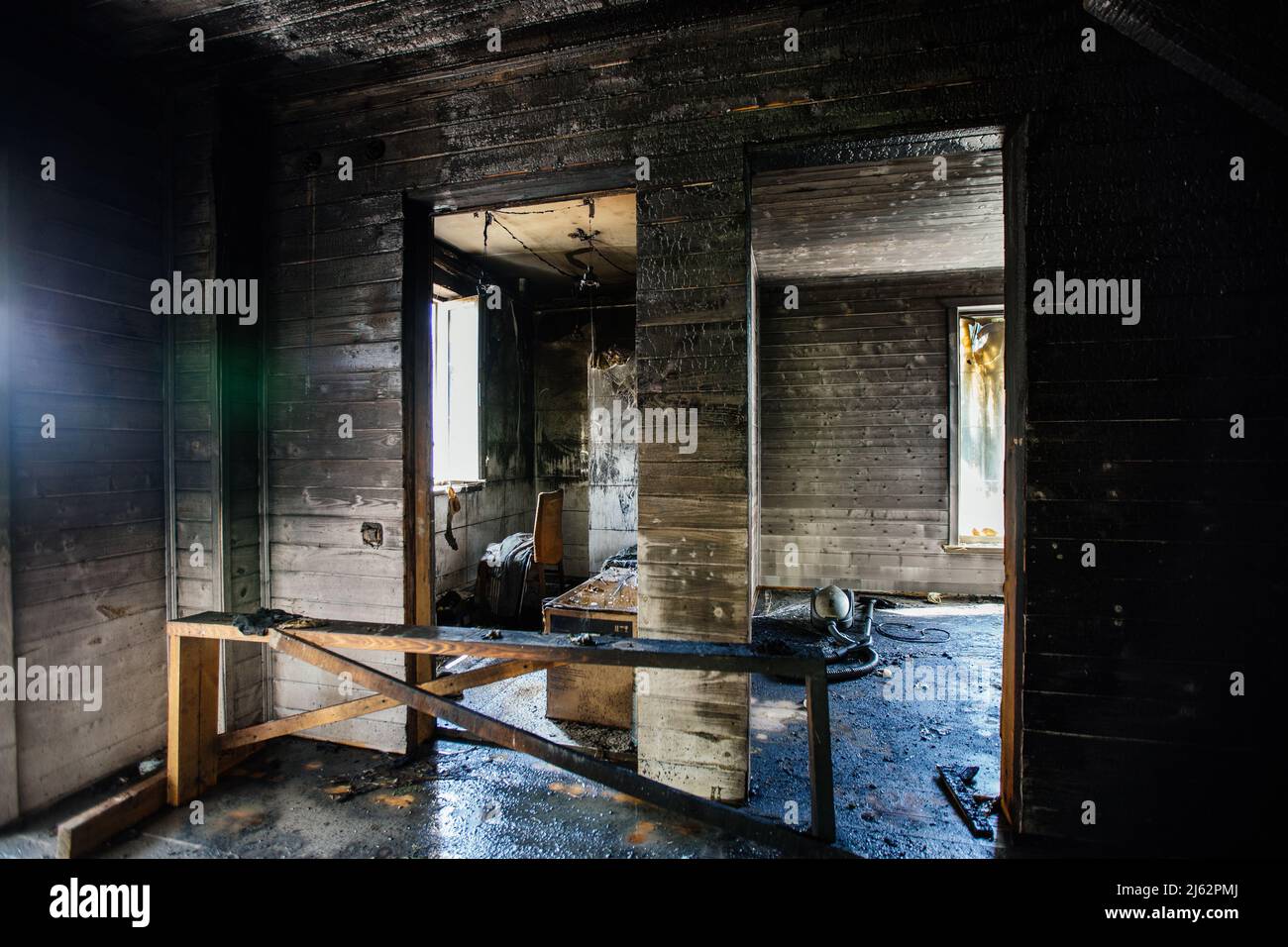 Burnt wooden house interior. Charred walls. Consequences of fire Stock ...