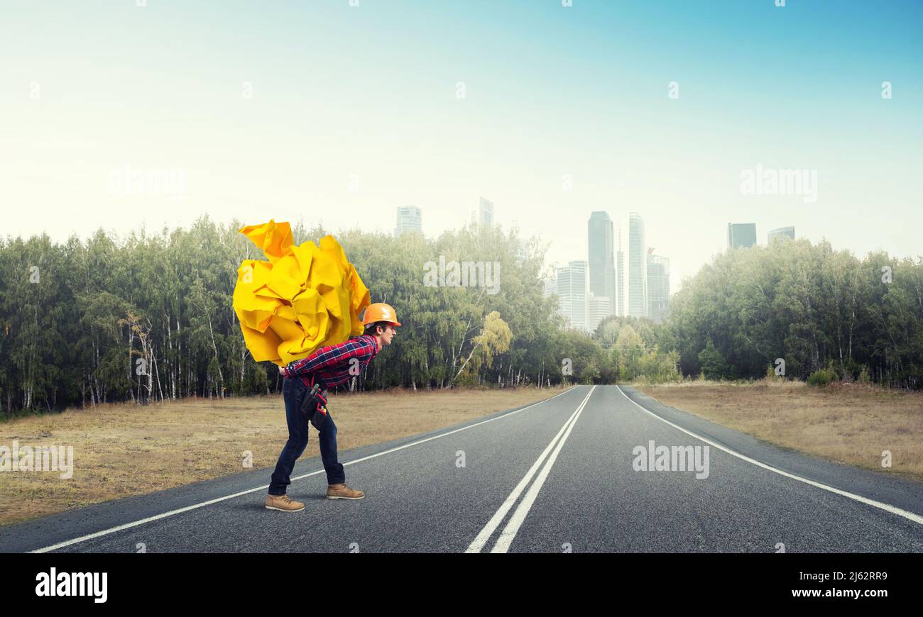 Engineer man carry load Stock Photo - Alamy