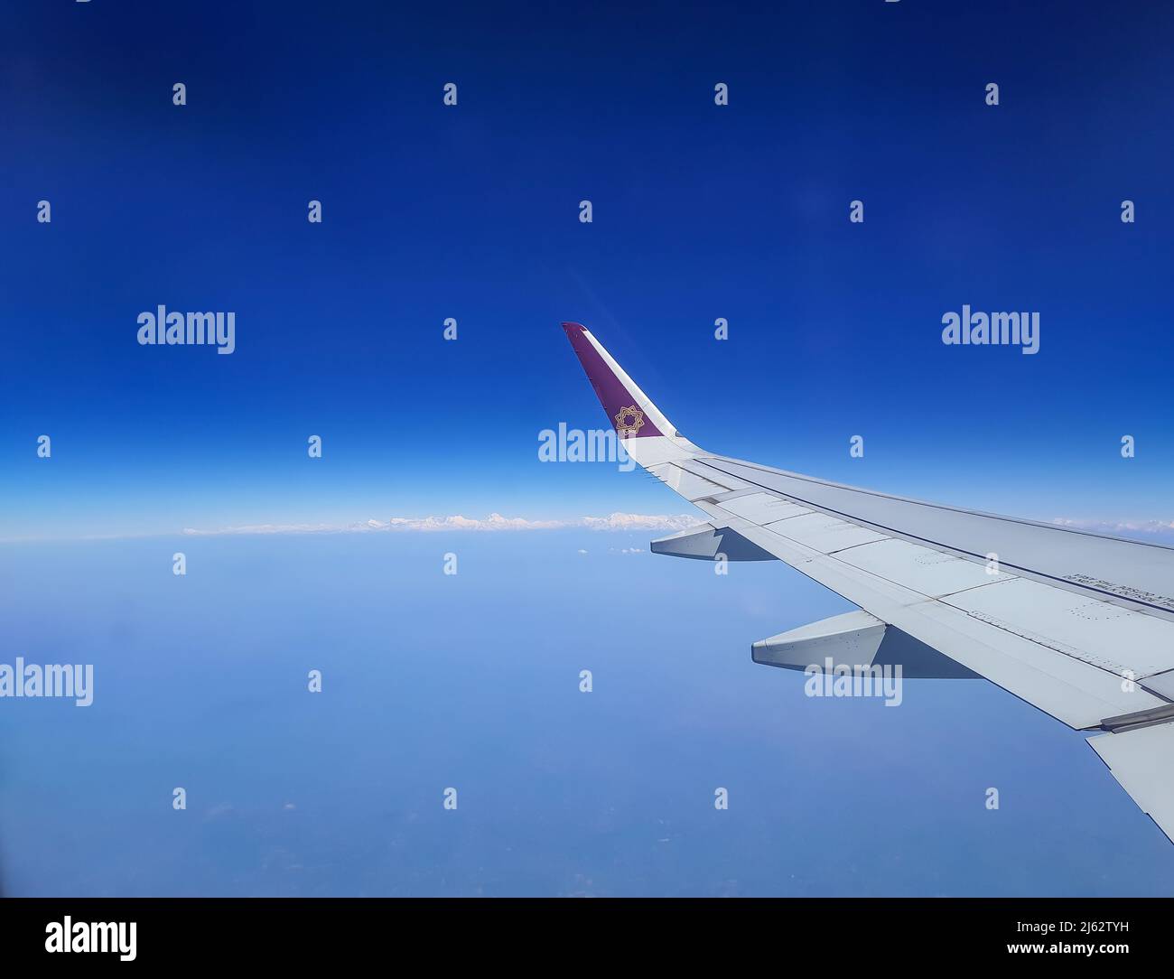 aircraft wings at mid air with bright blue sky background image is ...