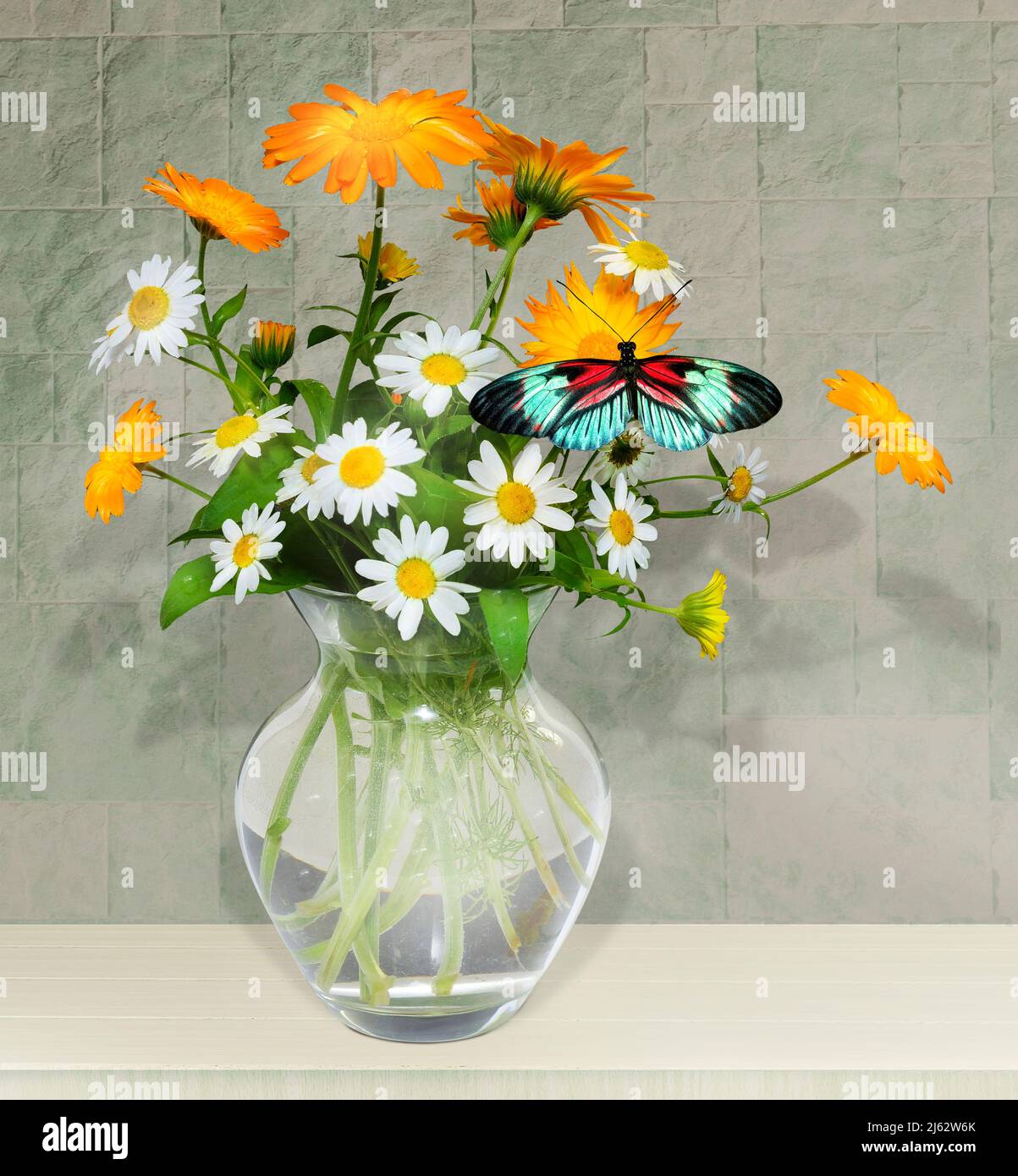 beautiful still life of summer flowers with a butterfly. bouquet ...