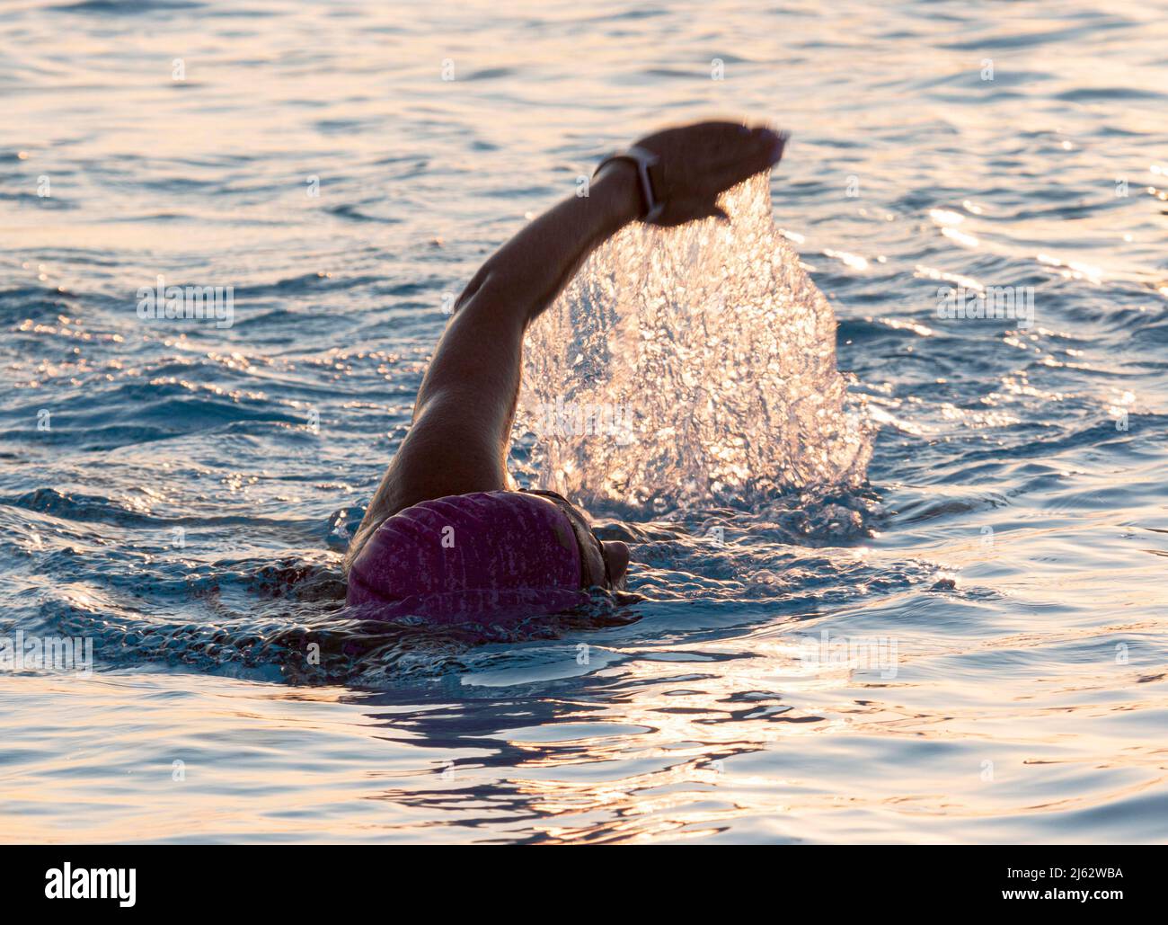 Swimmer in yellow swim cap hi-res stock photography and images - Alamy