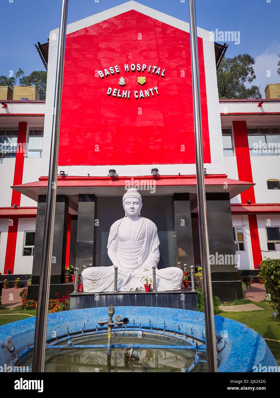 military hospital building with isolated white buddha statue at day ...