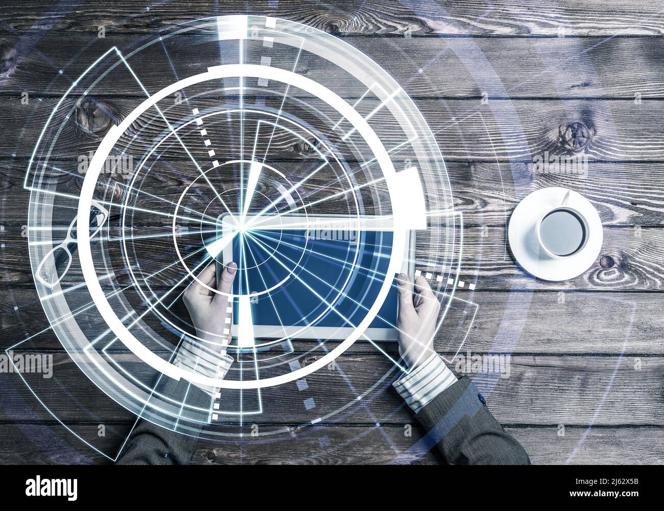 Business workplace with tablet device on wooden surface and media ...