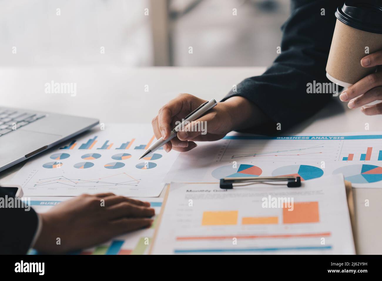 In an open space, a business team or accountant collaborates on an ...