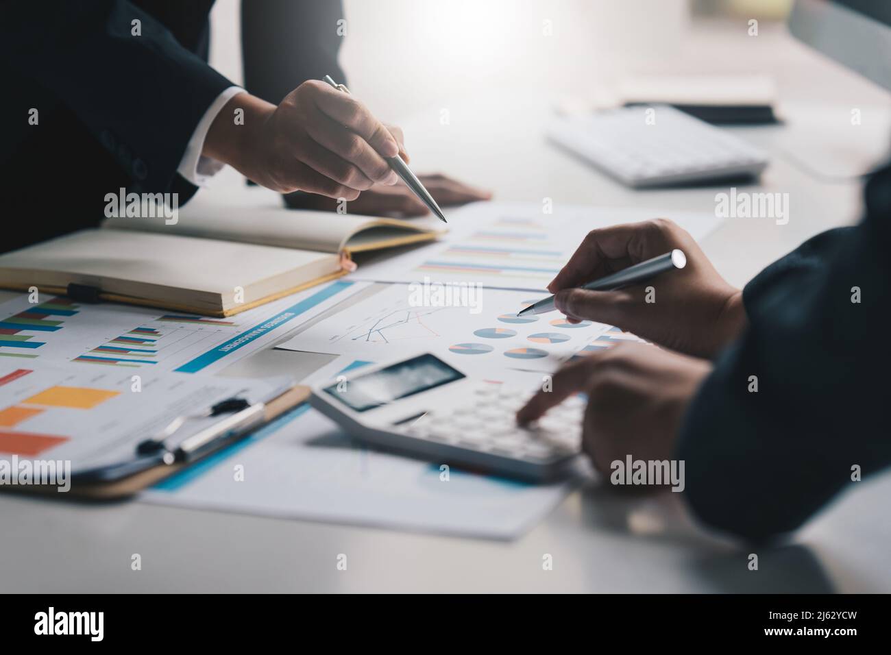 In an open space, a business team or accountant collaborates on an ...