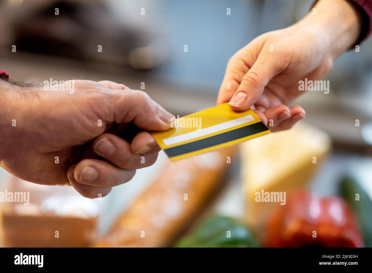 Unrecognizable male customer giving credit card to cashier Stock Photo ...