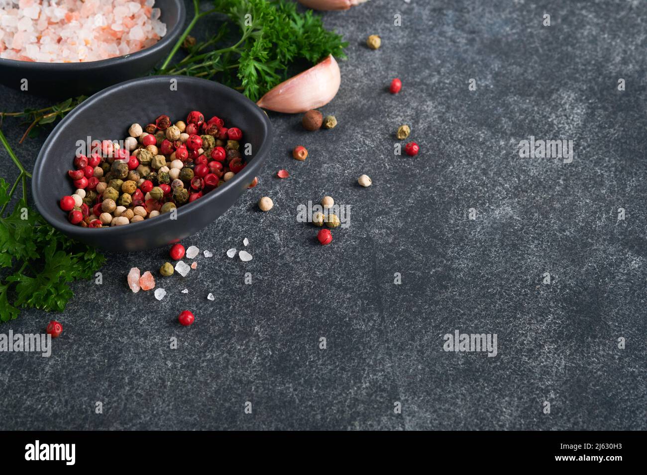 Black food cooking background. Stone texture with sea salt, pepper ...