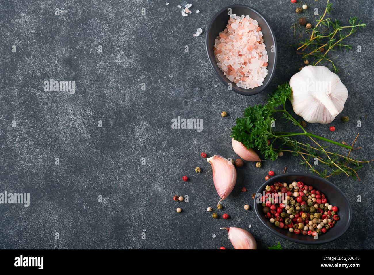 Black food cooking background. Stone texture with sea salt, pepper ...