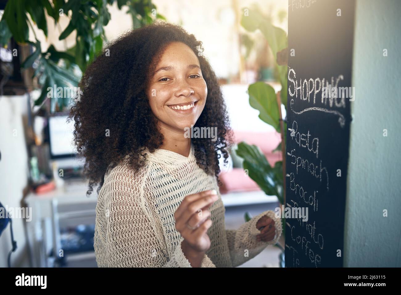 Happy girl smiling at camera Stock Photo - Alamy