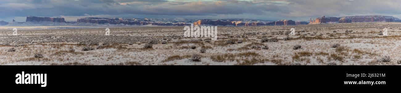 Panorama of Monument Valley covered in freshly fallen snow on a cloudy ...