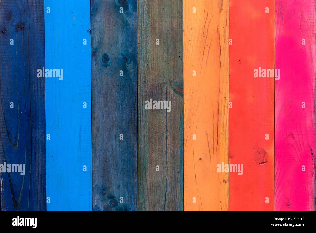 Wooden background painted with rainbow colors. Colorful wood texture ...