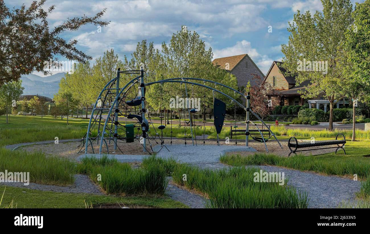 Panorama White puffy clouds Small playground area in a residential area ...