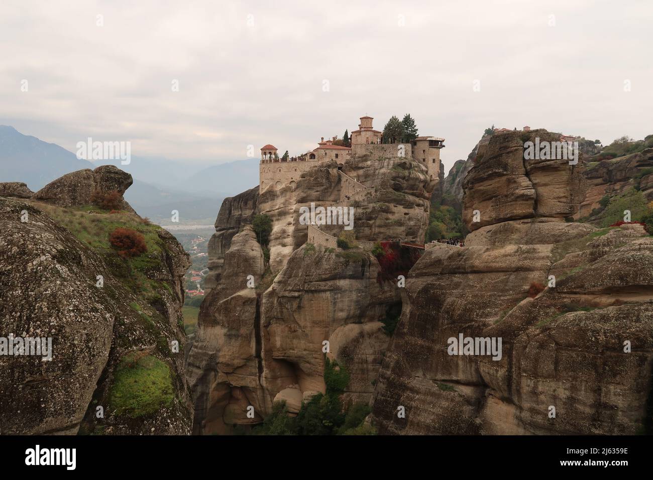 The Monastery of Varlaam appearing between rock formations, Meteora ...