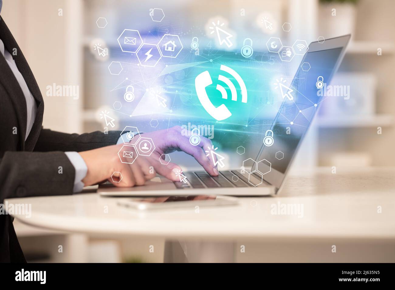 Hands working on laptop with digital icons Stock Photo - Alamy