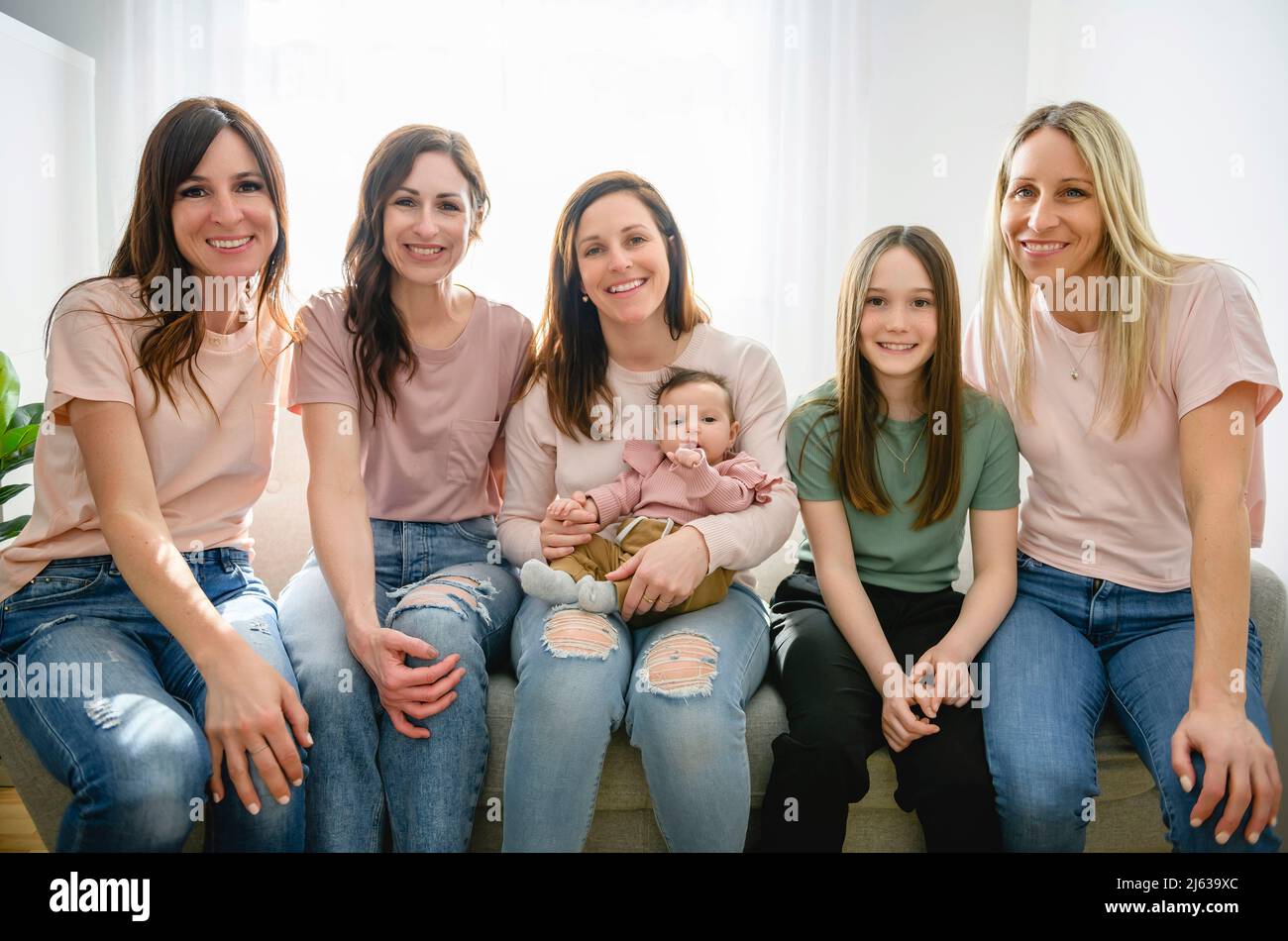 Young woman and baby with friends hi-res stock photography and images ...