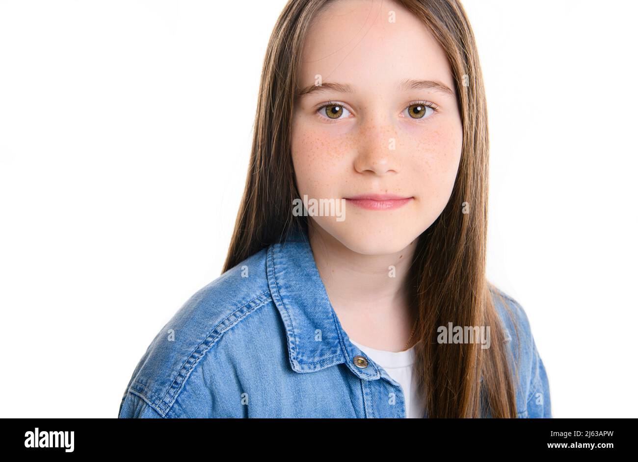 Young brunette pre teen girl on studio white Stock Photo - Alamy