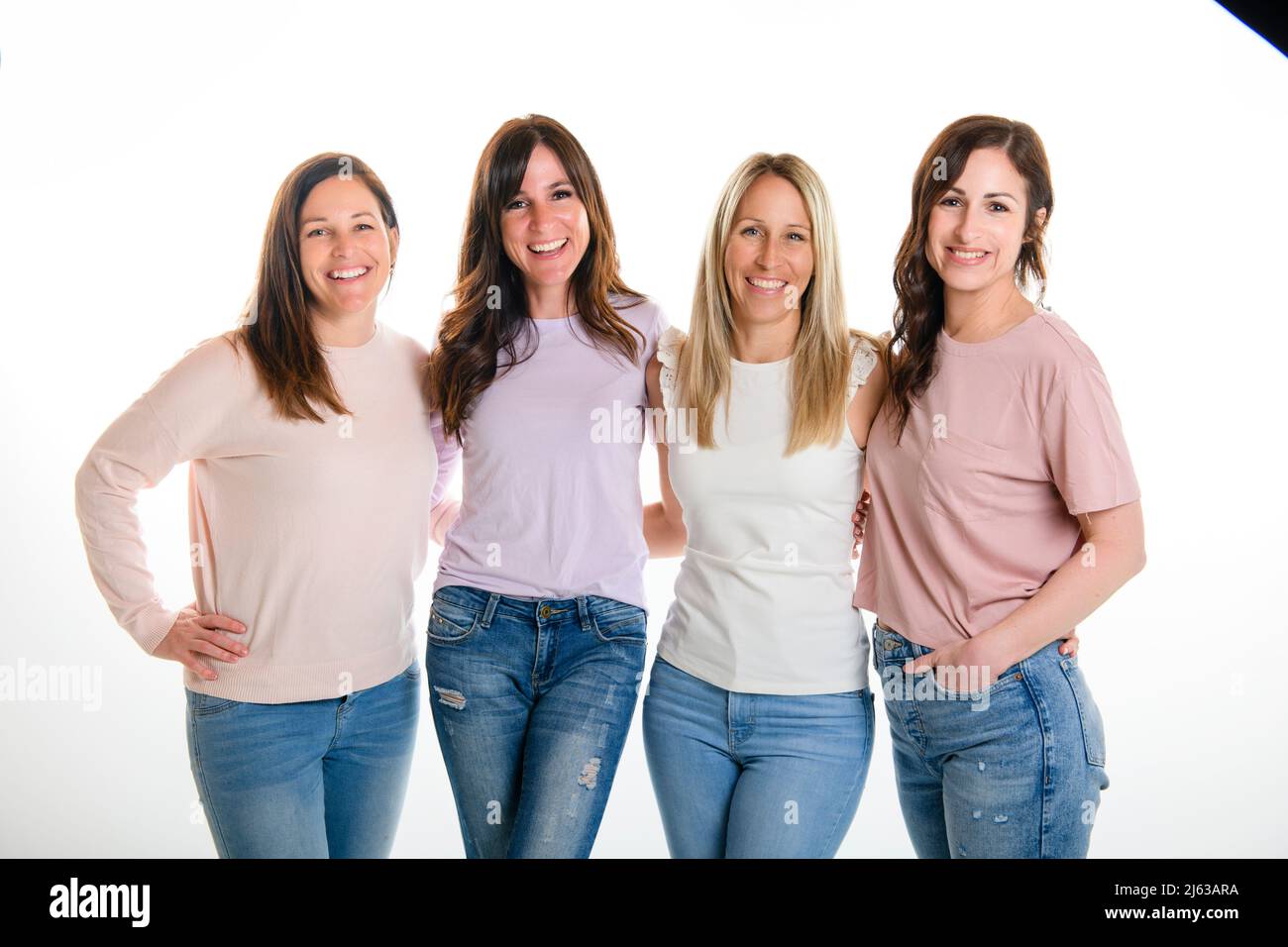 Portrait Of Four best friends Women In Studio Standing Stock Photo - Alamy