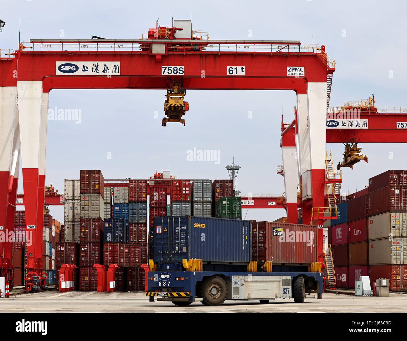 Shanghai. 27th Apr, 2022. A truck carrying containers is seen at the ...