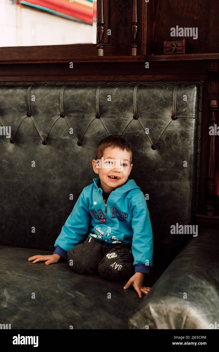 A small child without front teeth laughs merrily Stock Photo - Alamy