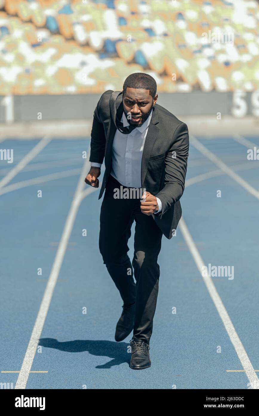 Man in suit tie running hi-res stock photography and images - Alamy