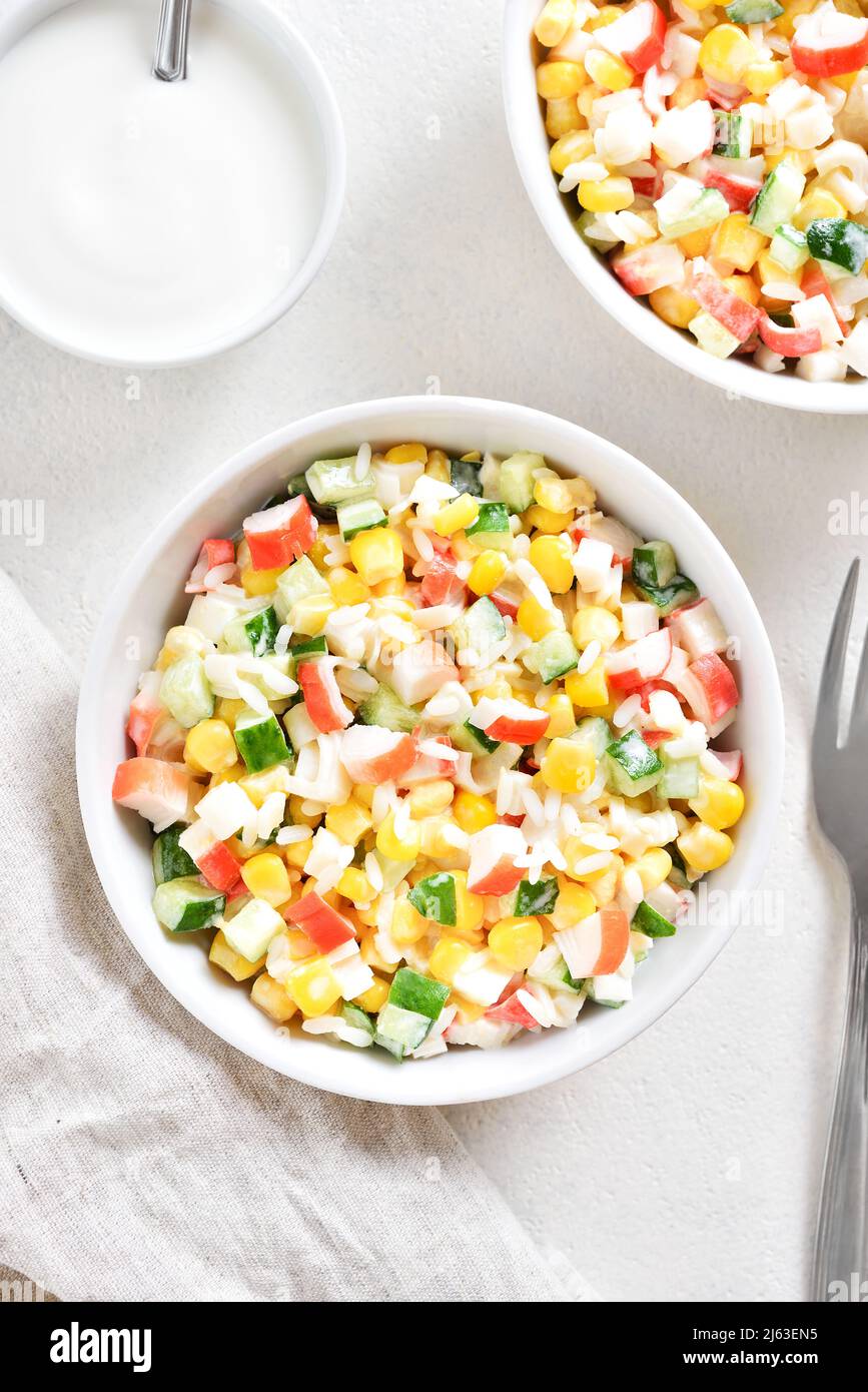 Russian style imitation crab salad with crab sticks, corn, eggs ...