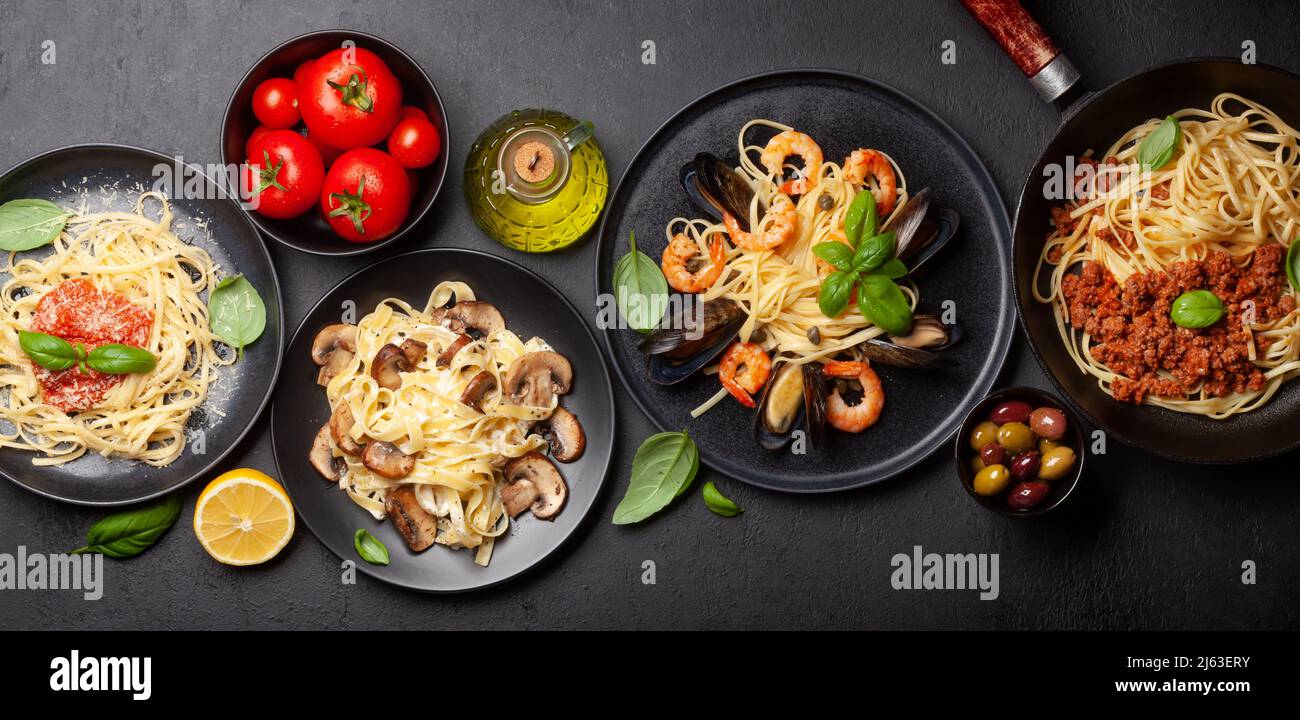 Various Italian pasta. Seafood, mushroom and tomato sauce pasta ...