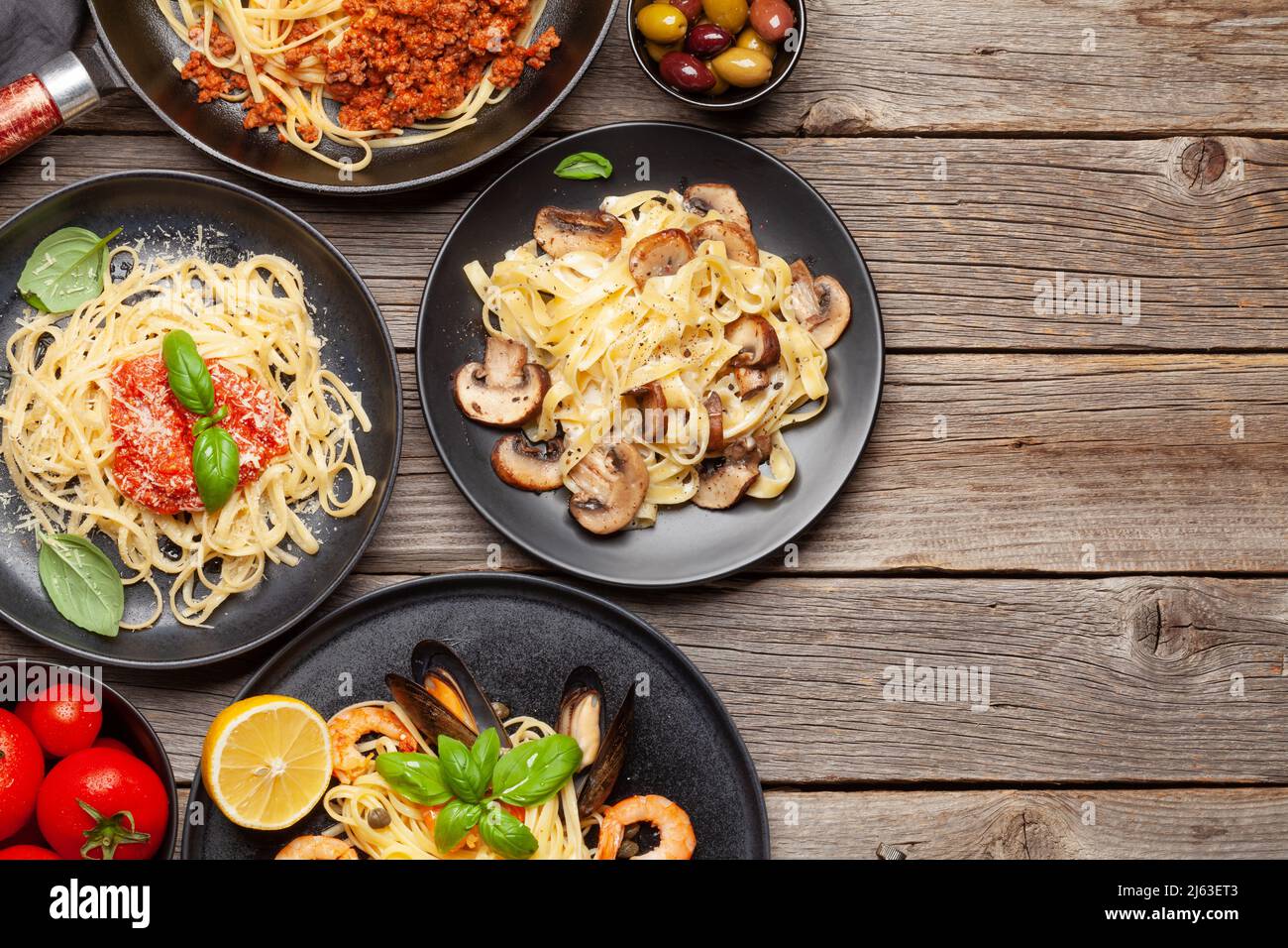 Various Italian pasta. Seafood, mushroom and tomato sauce pasta ...