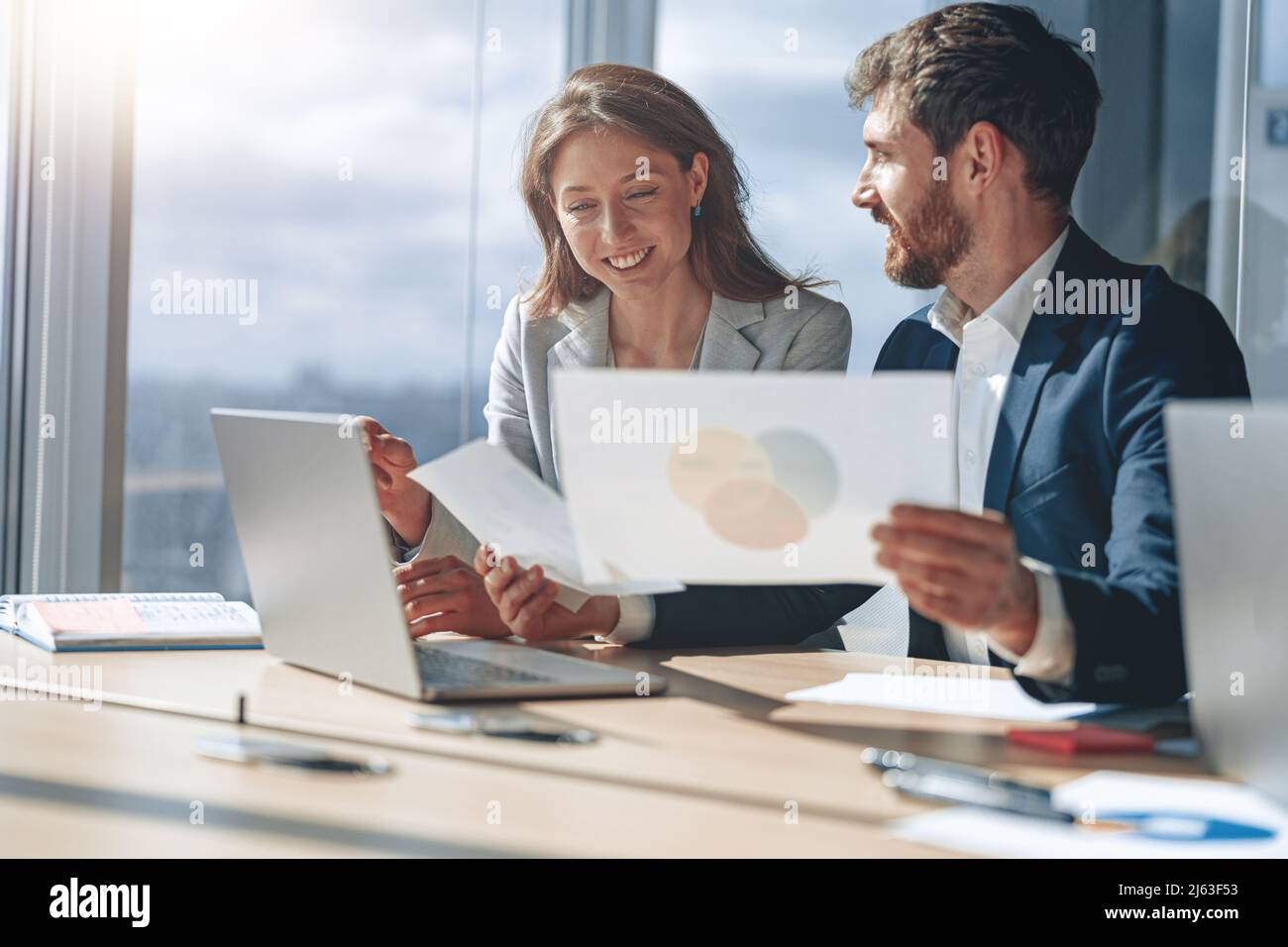 Two business people during work meeting in modern office explaining ...